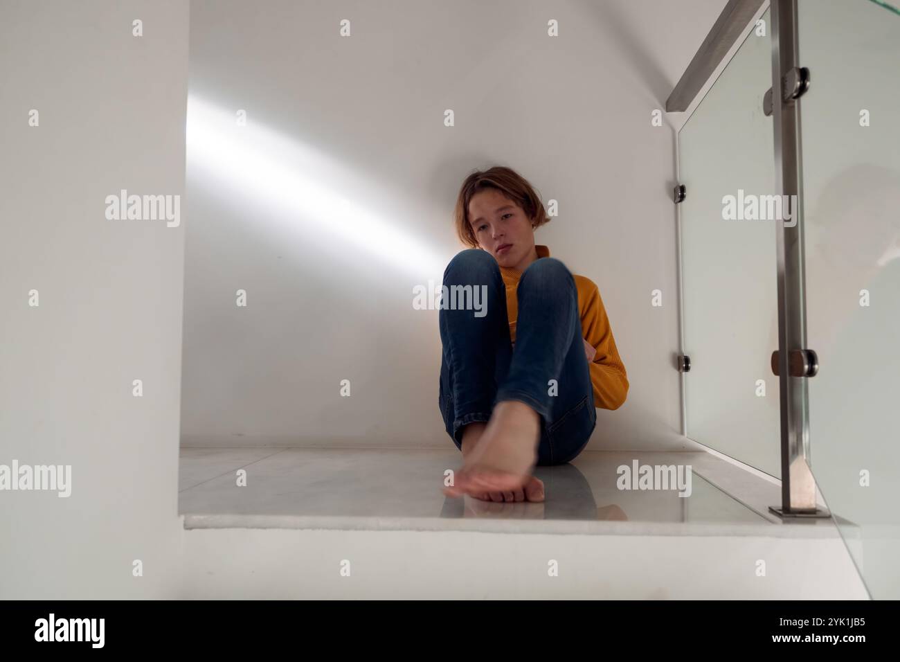 Boy sitting corner teenager hi-res stock photography and images - Alamy