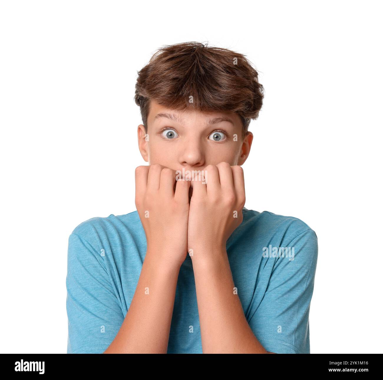 Portrait of scared teenage boy on white background Stock Photo - Alamy