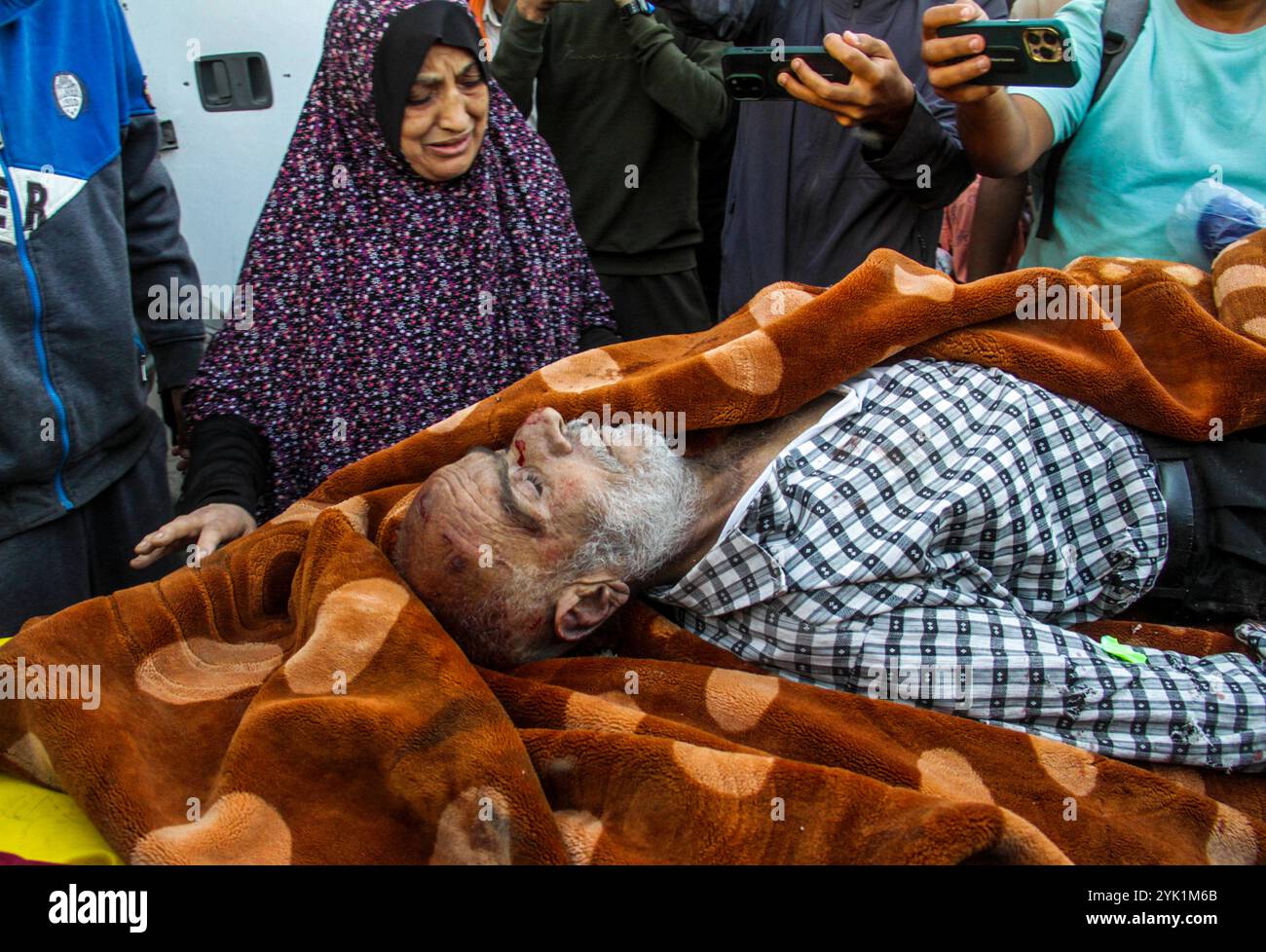 Middle East news. Palestinians bleed from their wounds after being ...