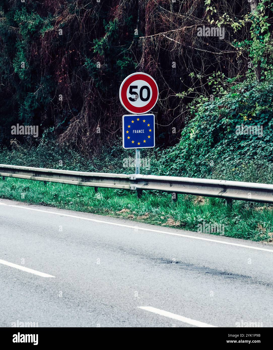 Speed limit sign indicating 50 km/h on a rural road in France ...