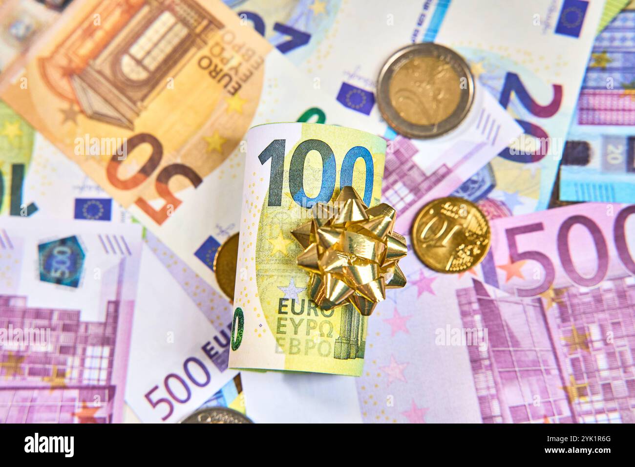 Bavaria, Germany - November 11, 2024: A rolled 100 euro bill bundle ...