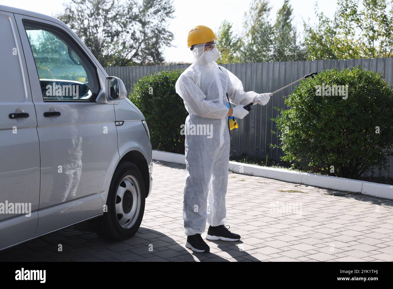 Pest control worker with spray tank outdoors Stock Photo - Alamy