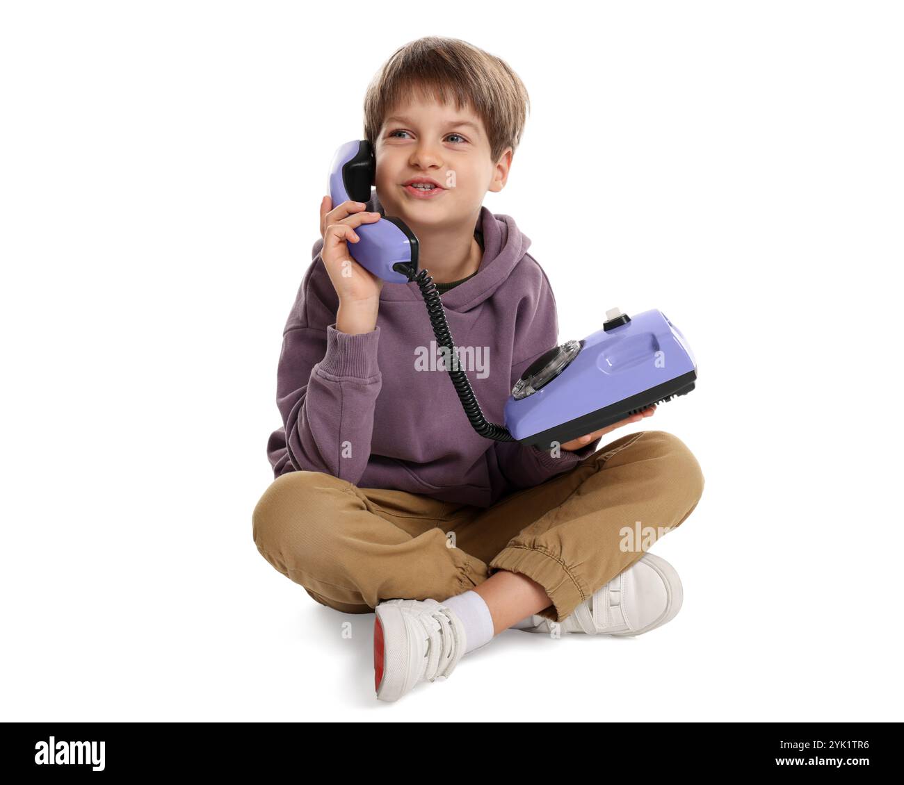 Cute little boy with old telephone on white background Stock Photo - Alamy
