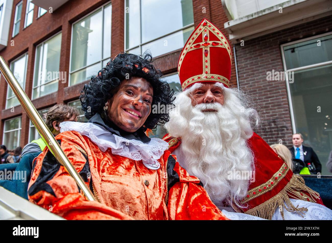 St. Nicholas and one of his helpers are seen posing for the camera. On ...