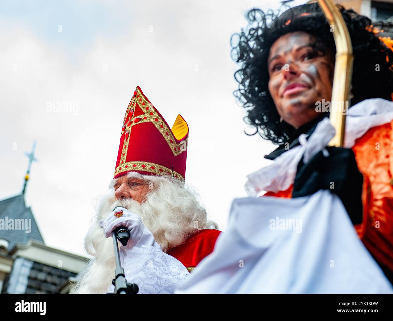 St. Nicholas is seen giving a speech to all the children at the square ...