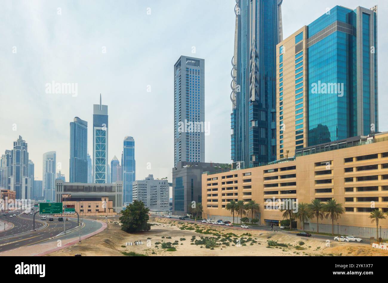 High-rise buildings and a spacious street in Dubai, highlighting the ...