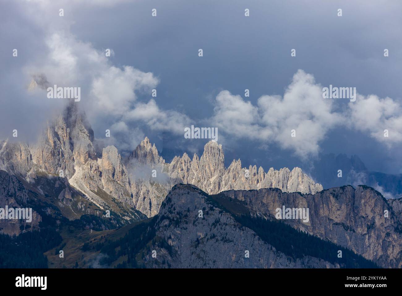 Mountains above the clouds stunning landscape. High rocky peaks rising ...