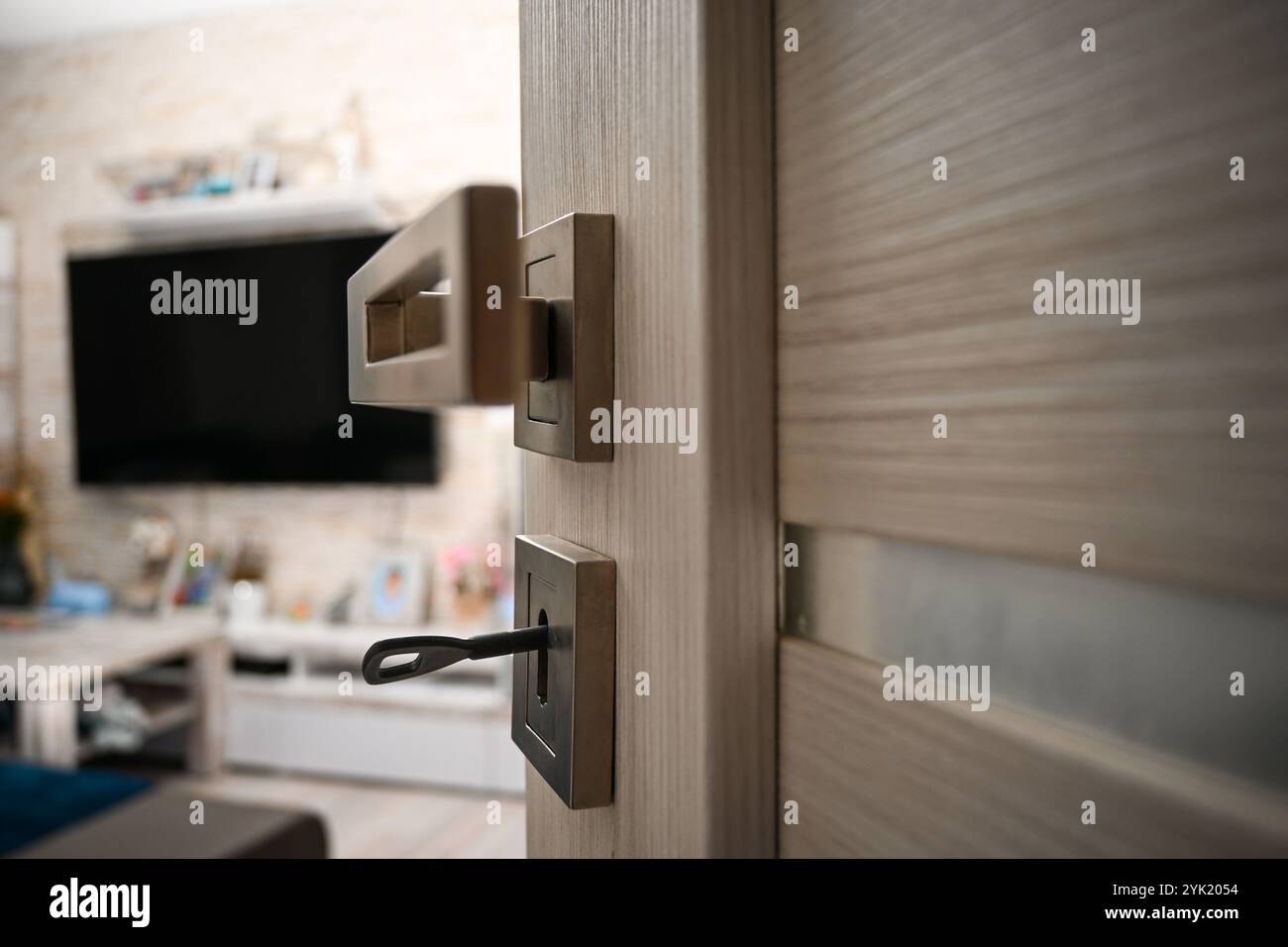 Modern door lock with key inserted, showcasing contemporary interior ...