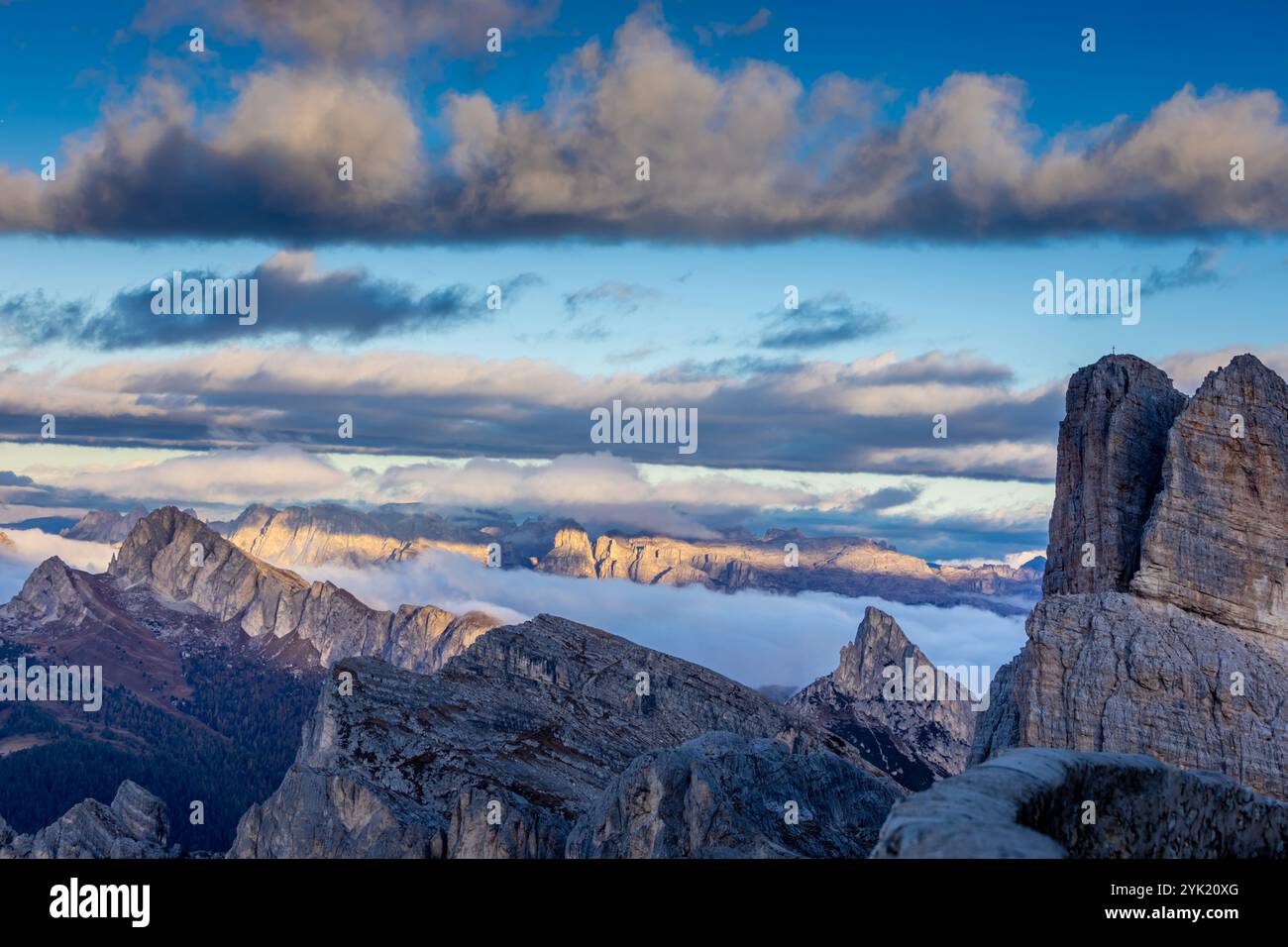 Mountains above the clouds stunning landscape. High rocky peaks rising ...