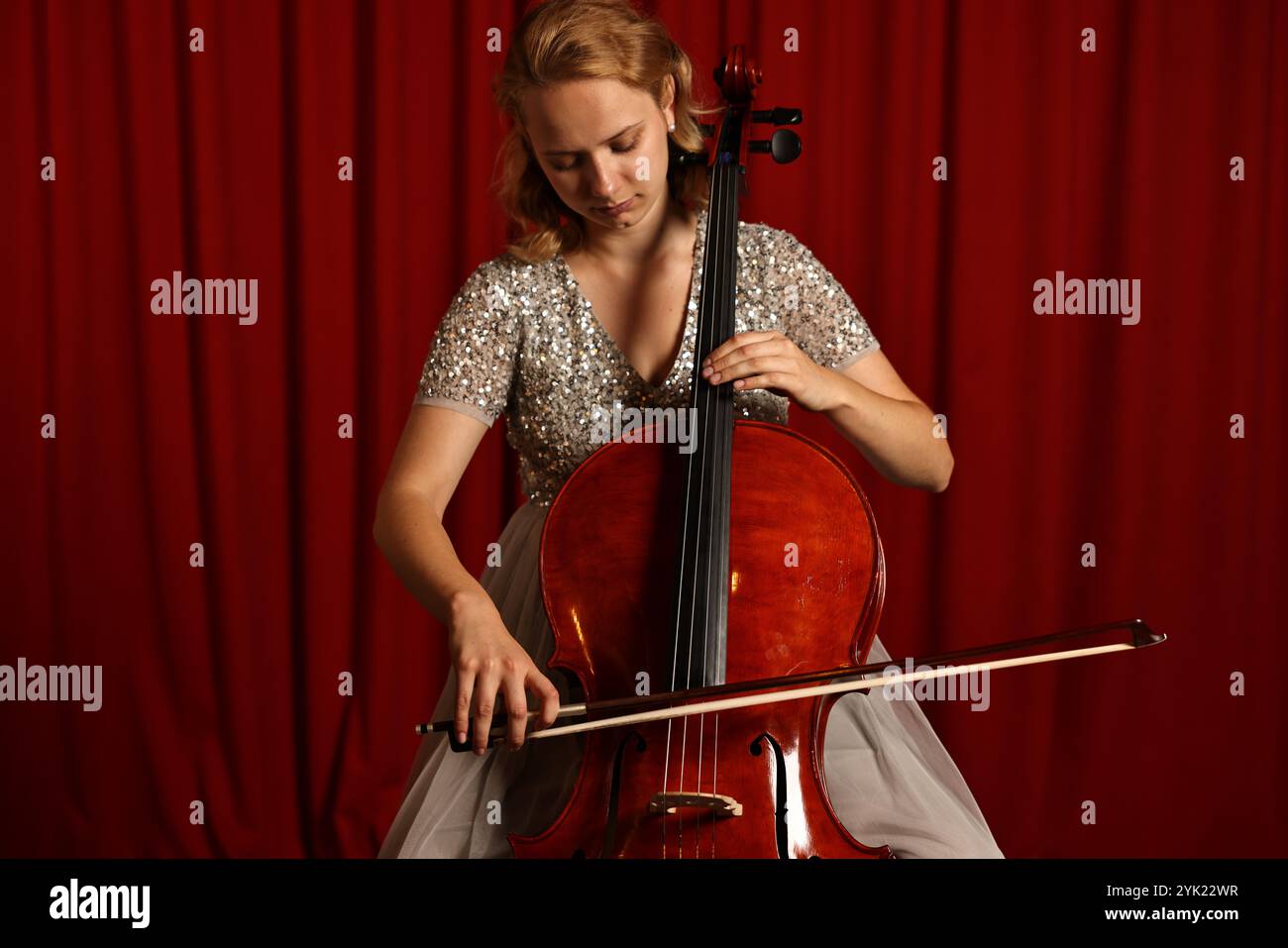 Professional cellist playing on stage hi-res stock photography and ...