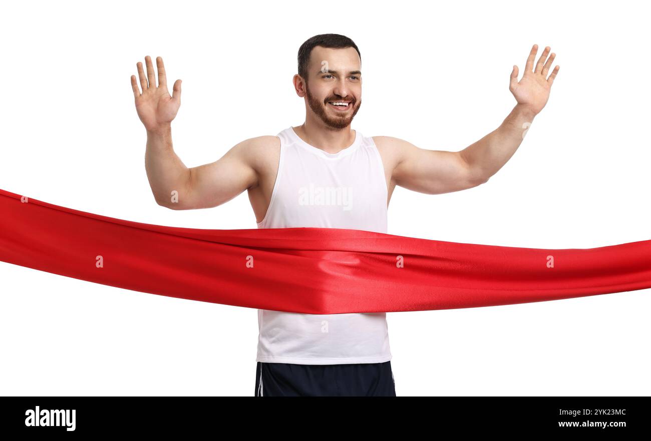Handsome young man crossing red finish line on white background Stock ...