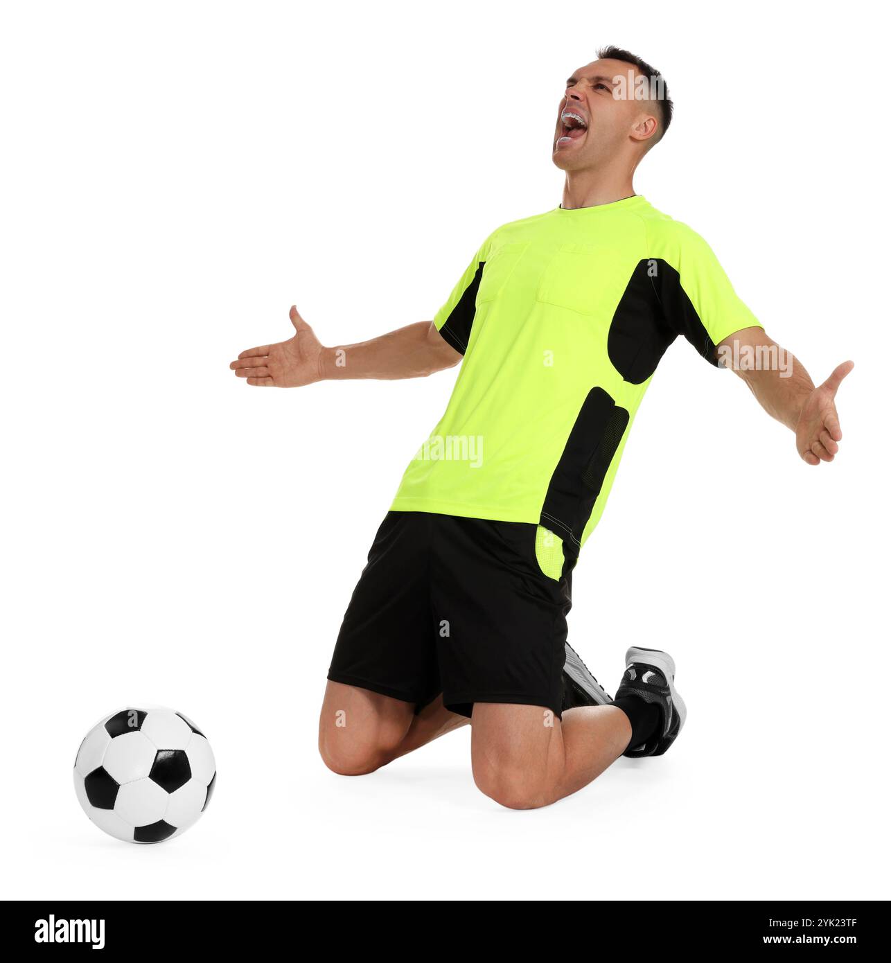 Emotional football player shouting and soccer ball on white background ...