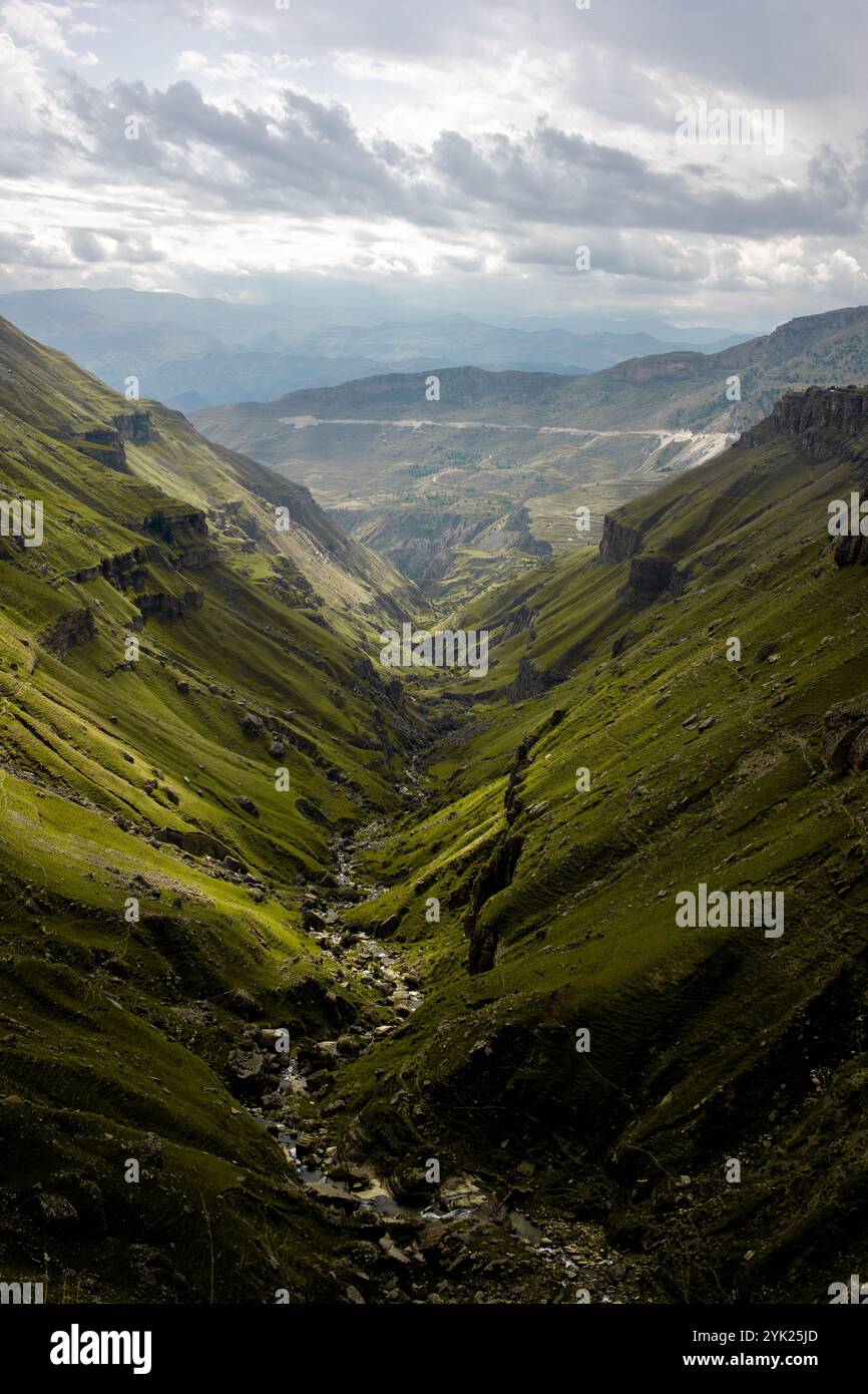 An epic view of a huge mountain rift, the terrain is covered with ...