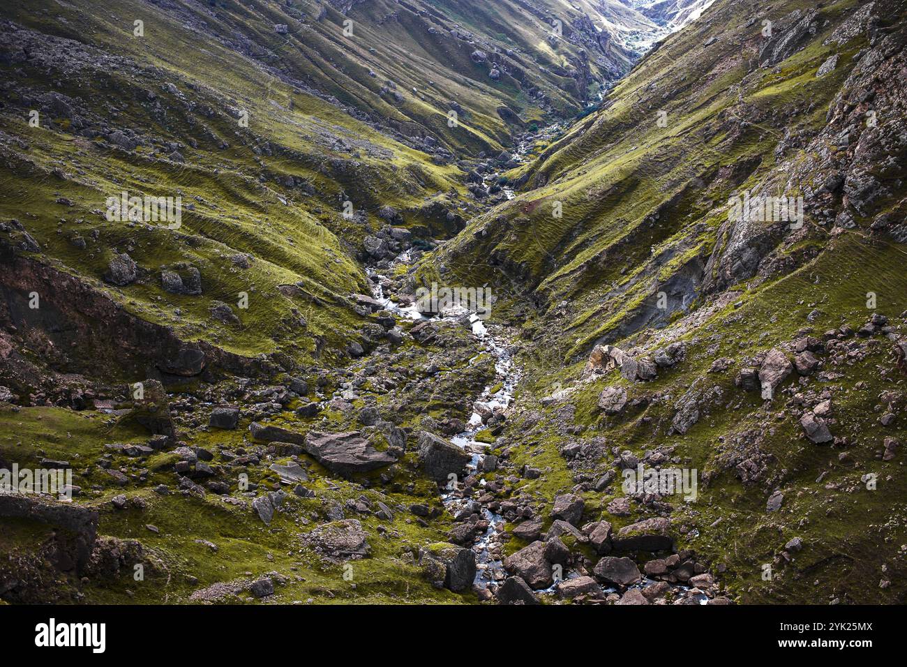An epic view of a huge mountain rift, the terrain is covered with ...