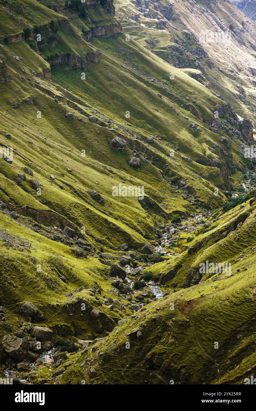 An epic view of a huge mountain rift, the terrain is covered with ...