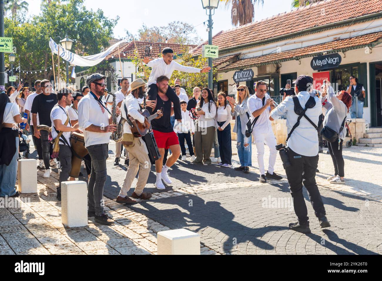 Zichron Yaakov, Israel – November 12, 2024, the men are carrying the ...