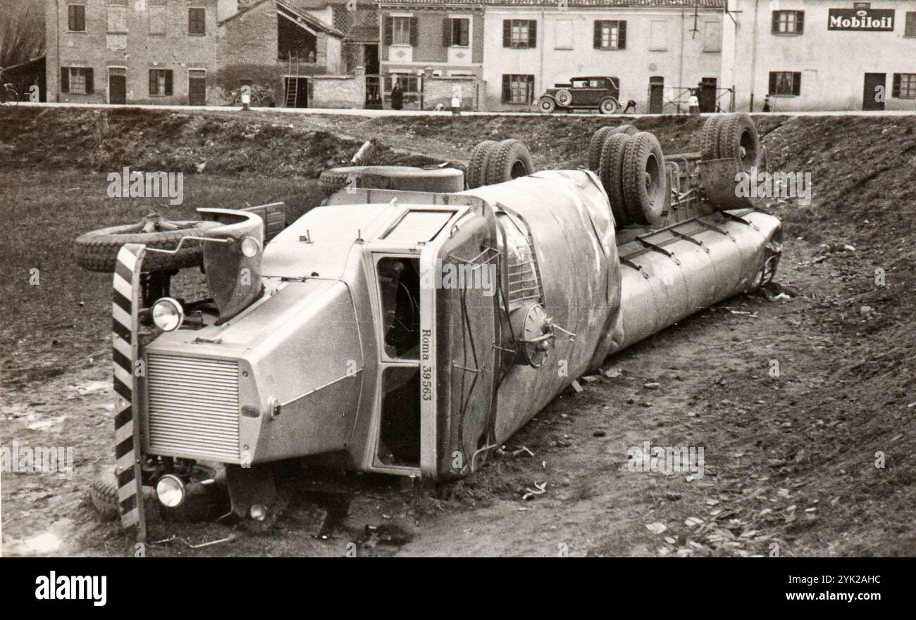 A truck with trailer that flipped over in an accident in mid thirties ...