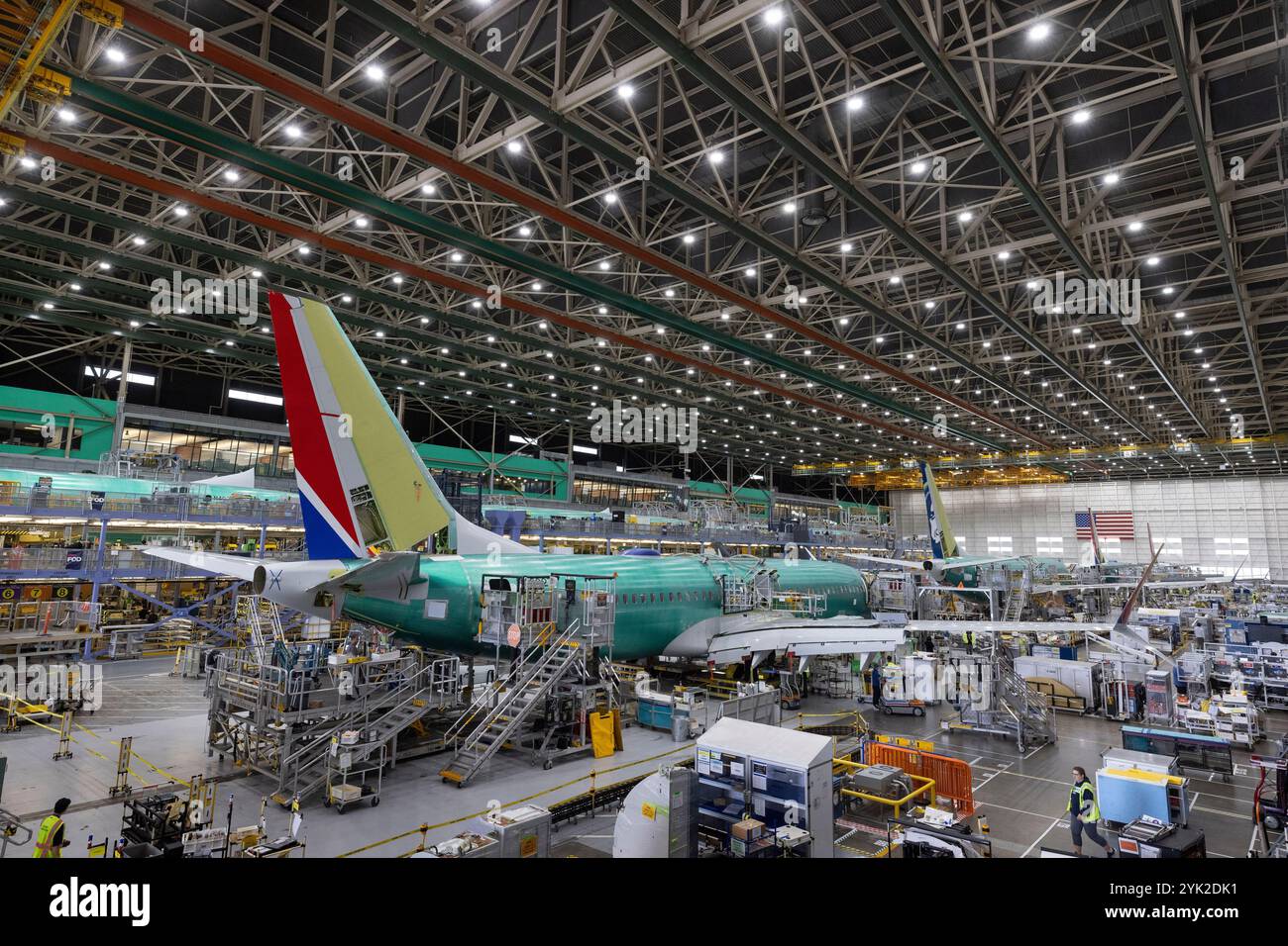 FILE - Boeing employees work on the 737 MAX on the final assembly line ...