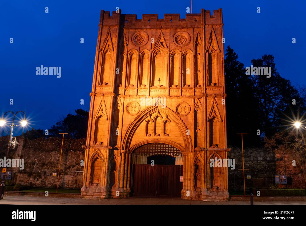The illuminated Abbey Gate is the entrance to the Abbey Gardens in Bury ...