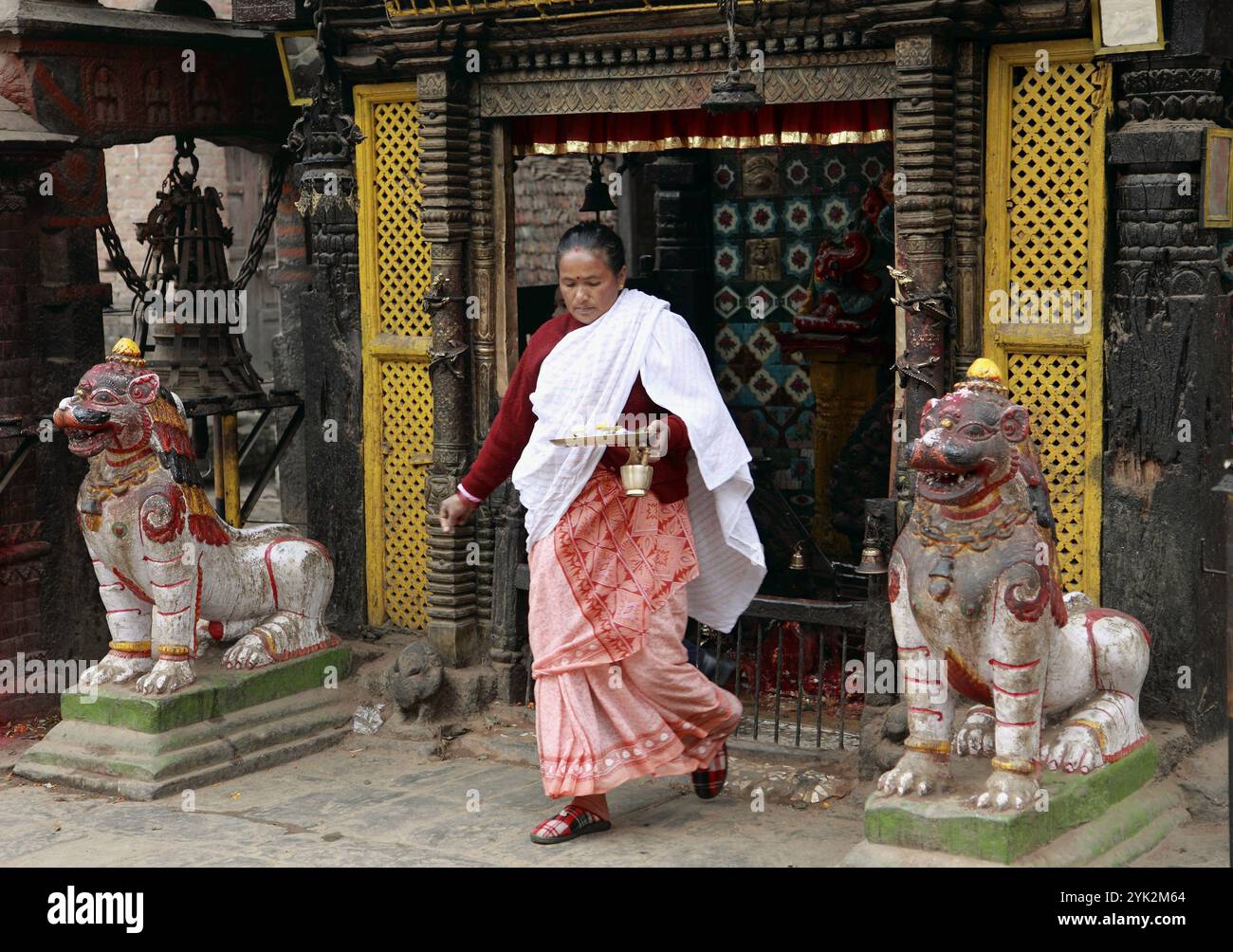 Nepal, Kathmandu Valley, Bhaktapur, woman making religious ritual ...