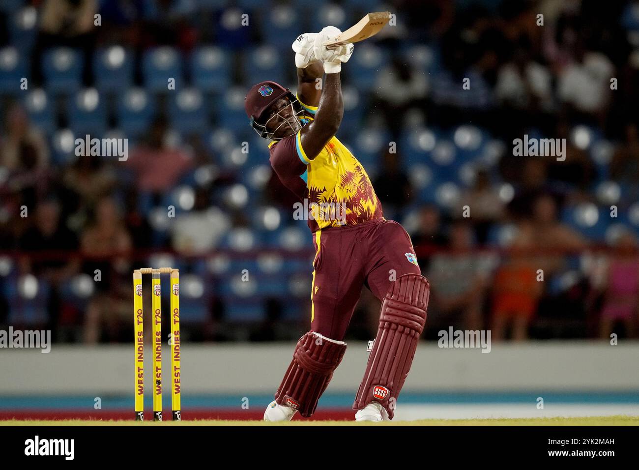 West Indies' captain Rovman Powell eyes the ball after hitting for six ...