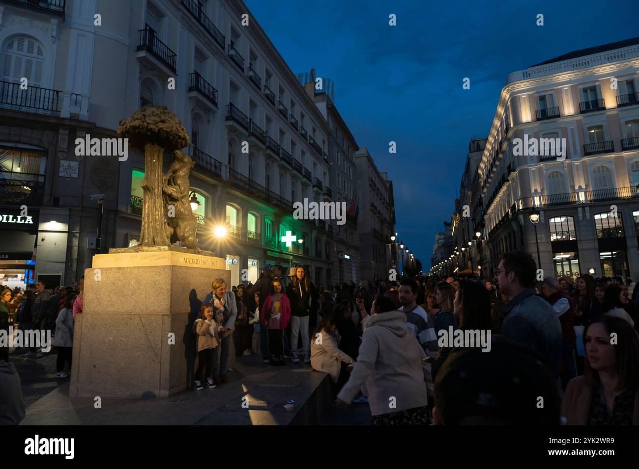 People crowd El Oso y el Madroño statue for photos in Puerta del Sol in ...