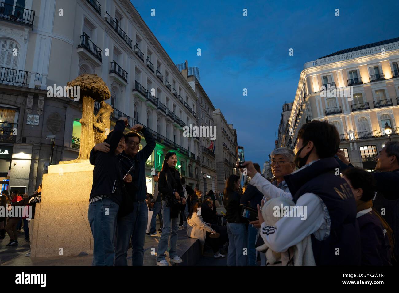 People crowd El Oso y el Madroño statue for photos in Puerta del Sol in ...