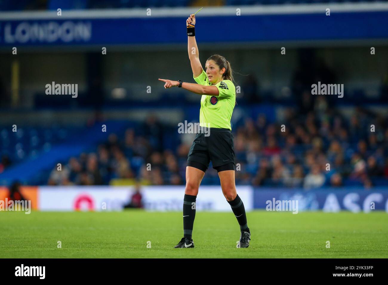 Referee Melissa Burgin shows a yellow card during the Barclays Women's ...