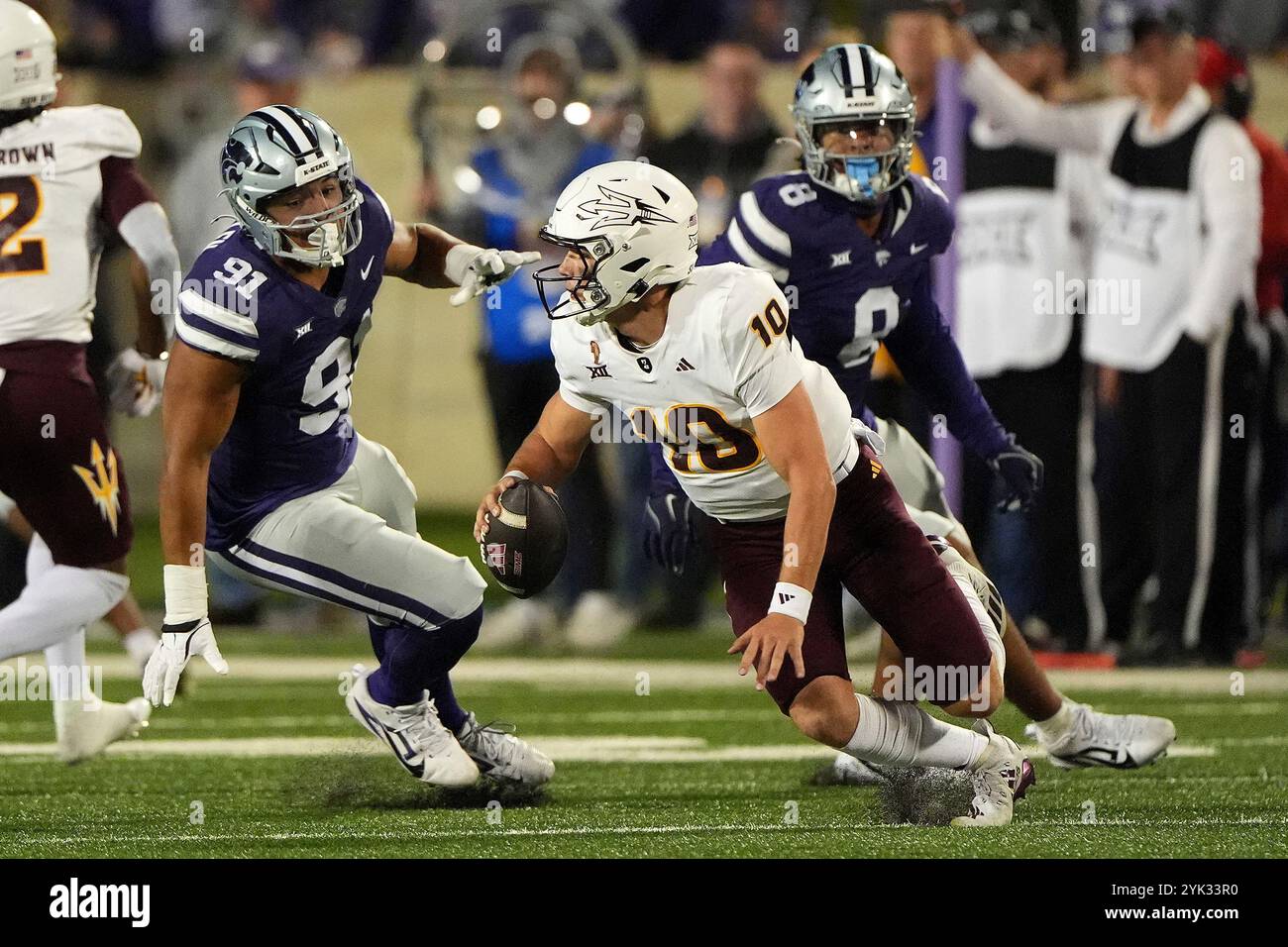 Arizona State quarterback Sam Leavitt (10) is chased by Kansas State ...