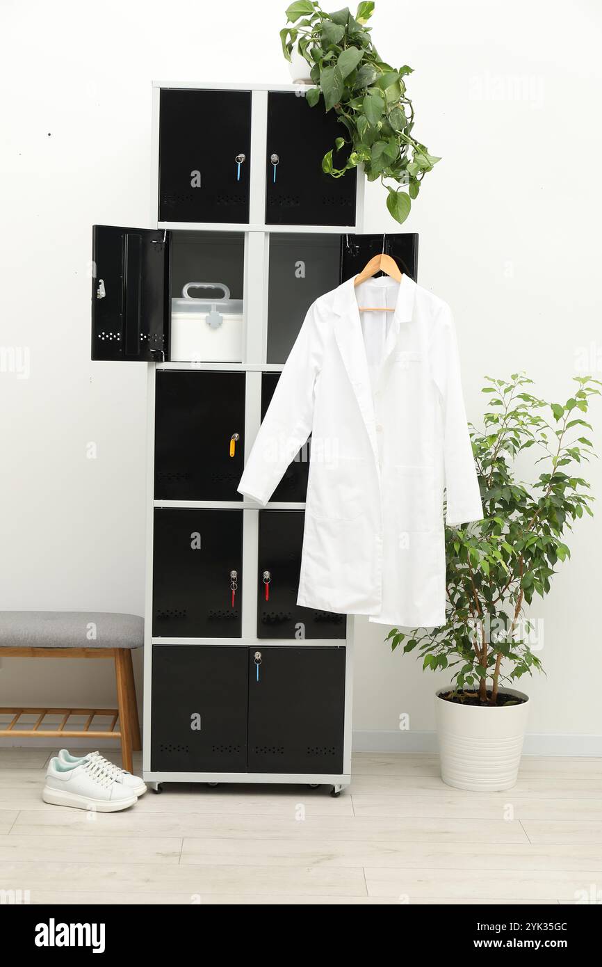 Medical personnel uniform on locker in changing room Stock Photo - Alamy
