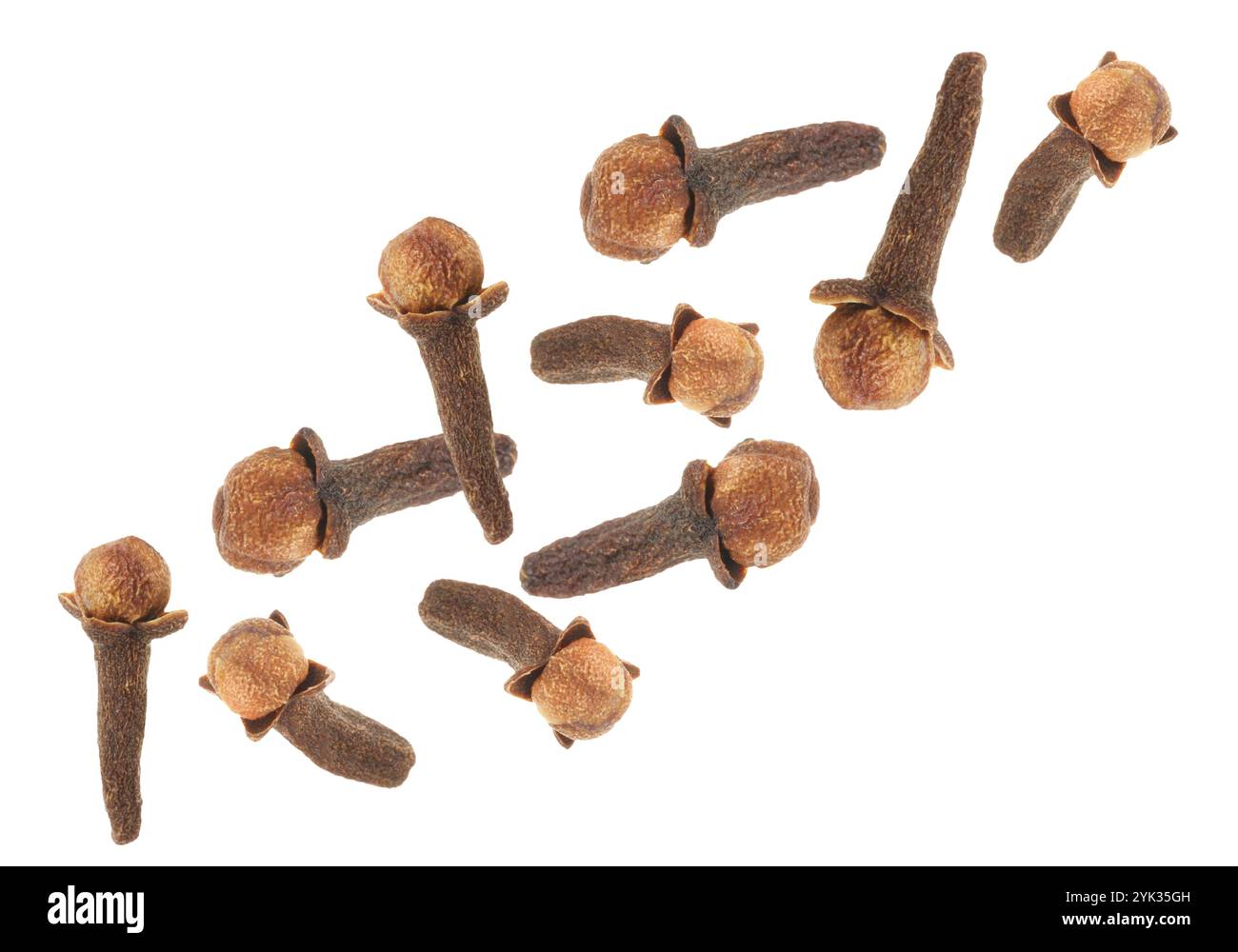 Clove buds in air on white background. Aromatic spice Stock Photo - Alamy