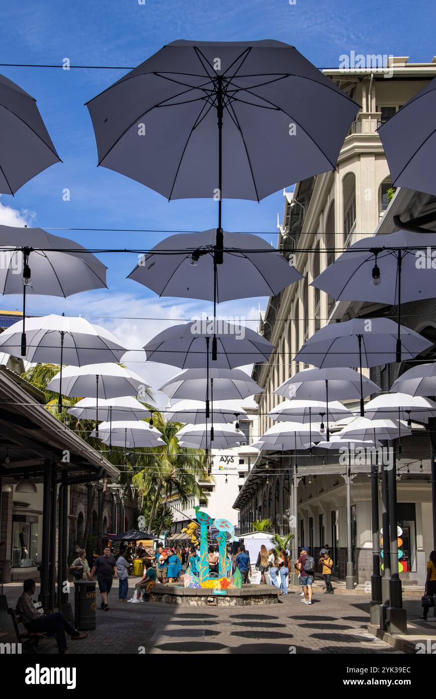 White umbrellas in the pedestrian zone at the Barkly Wharf harbor and ...
