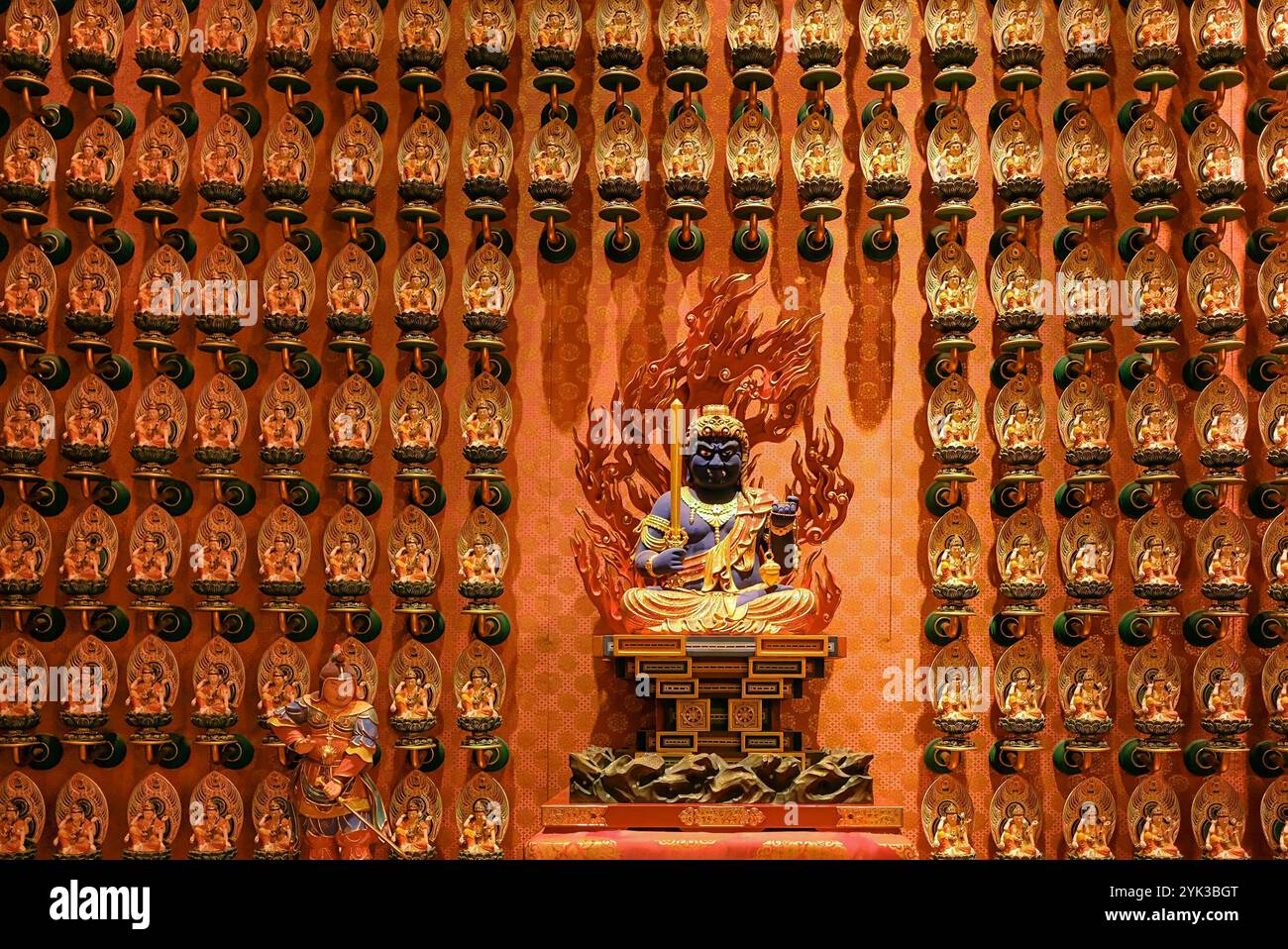 Wide angle view of blue Acala Vidyaraja deity statue surrounded by a ...