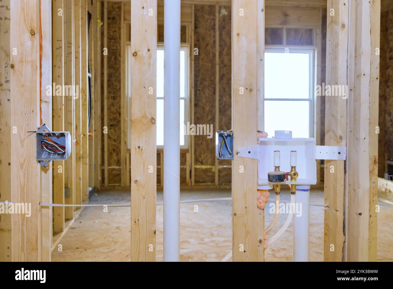 Construction of new home interior featuring exposed wooden frame ...
