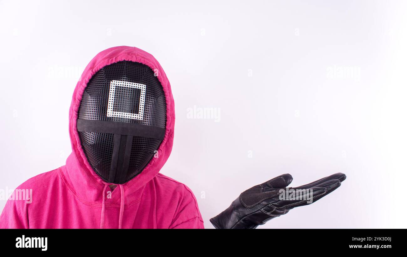 Pink Guard from Squid Game of Netflix show. Squid Game red guard holds ...