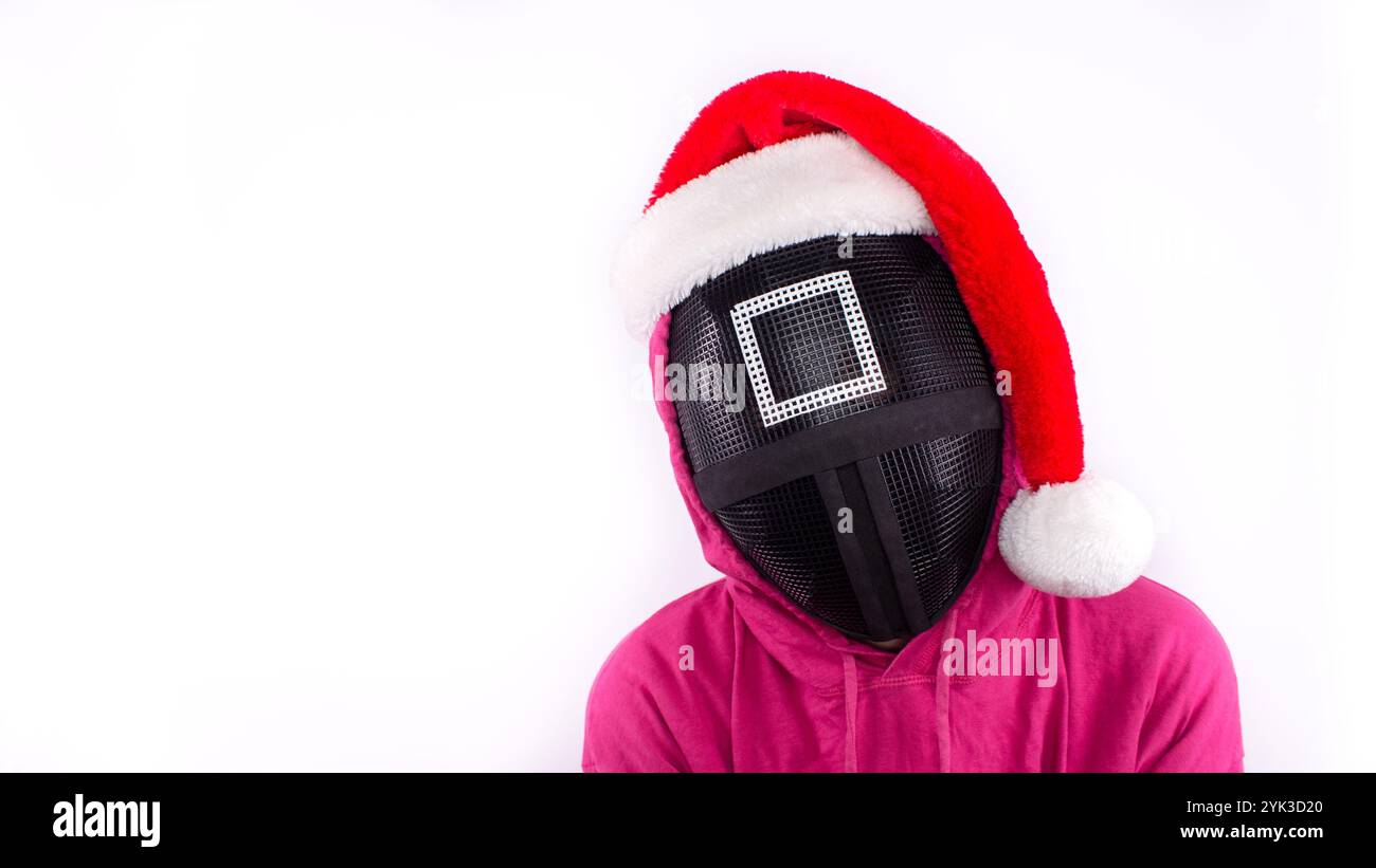 Squid Game pink guard with Christmas hat on white background. Space for ...