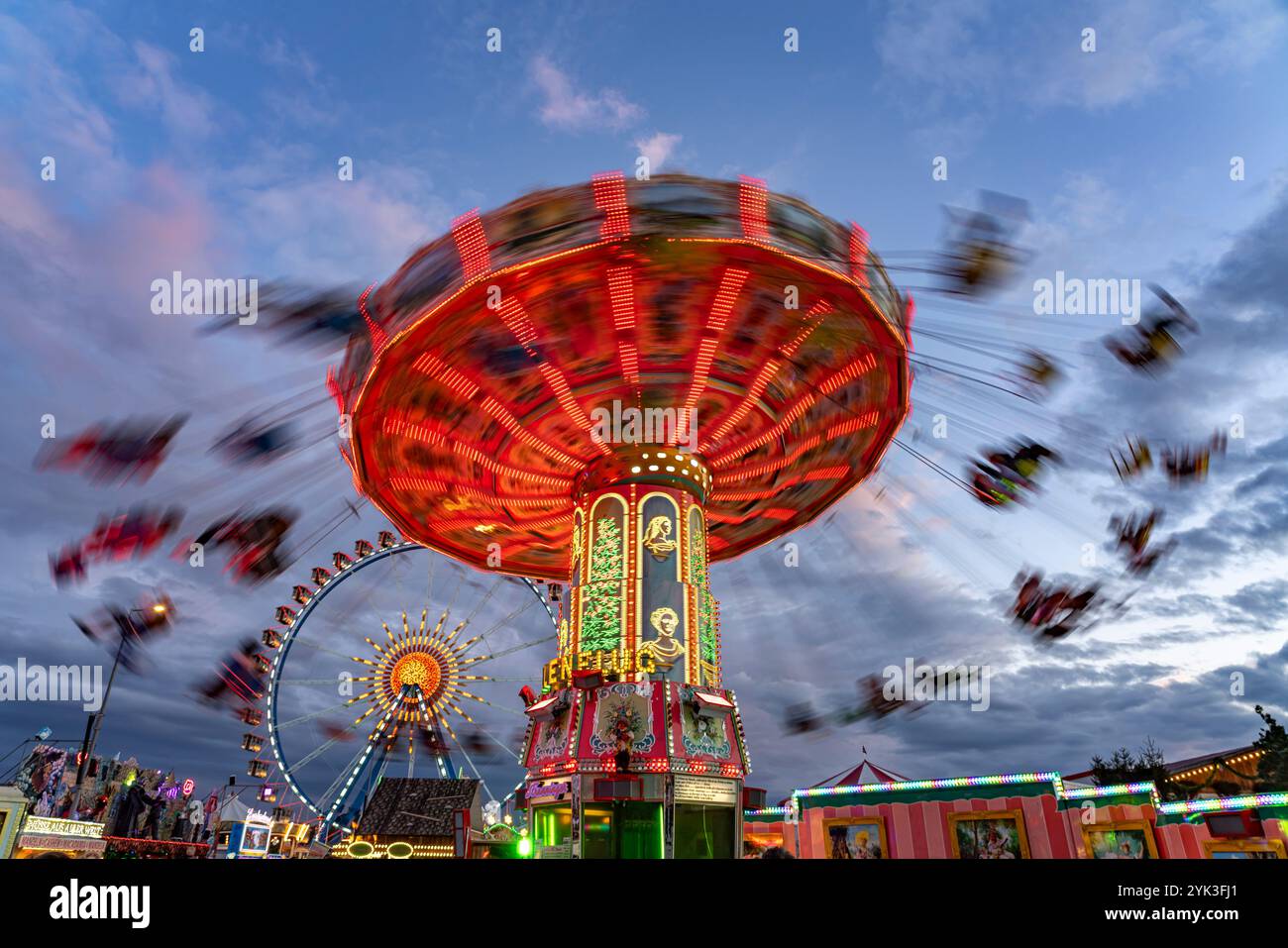 Swing carousel at Oktoberfest 2024 at dusk, Munich, Bavaria, Germany ...