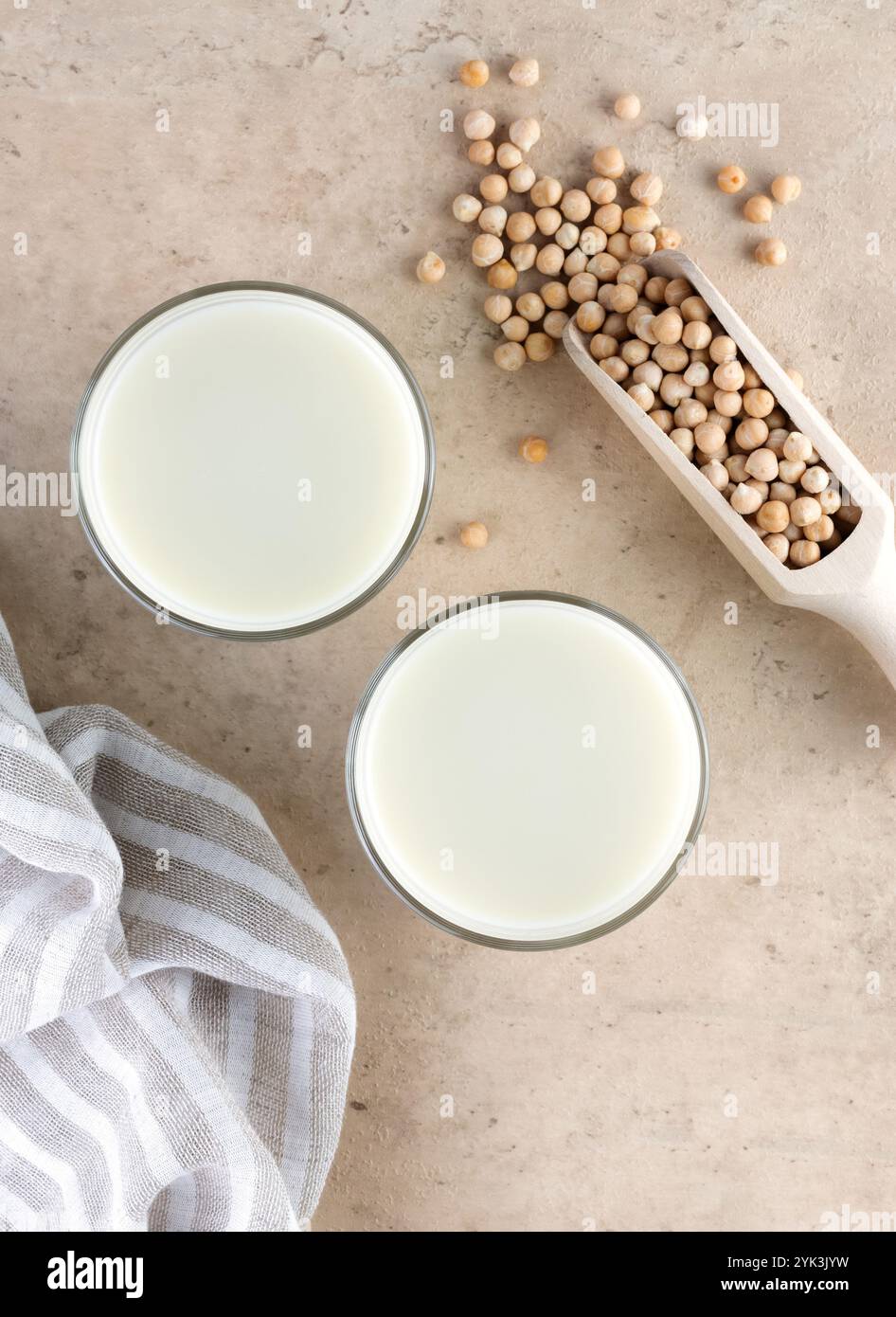 Chickpea milk with chickpeas on a beige background. Top view Stock ...