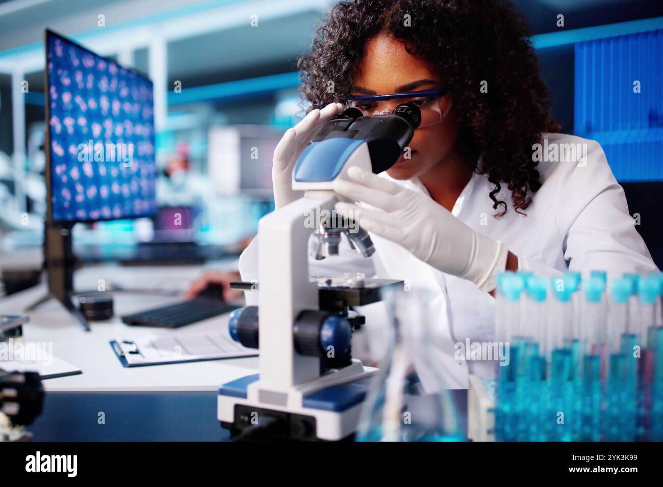 Mature scientist using microscope hi-res stock photography and images ...