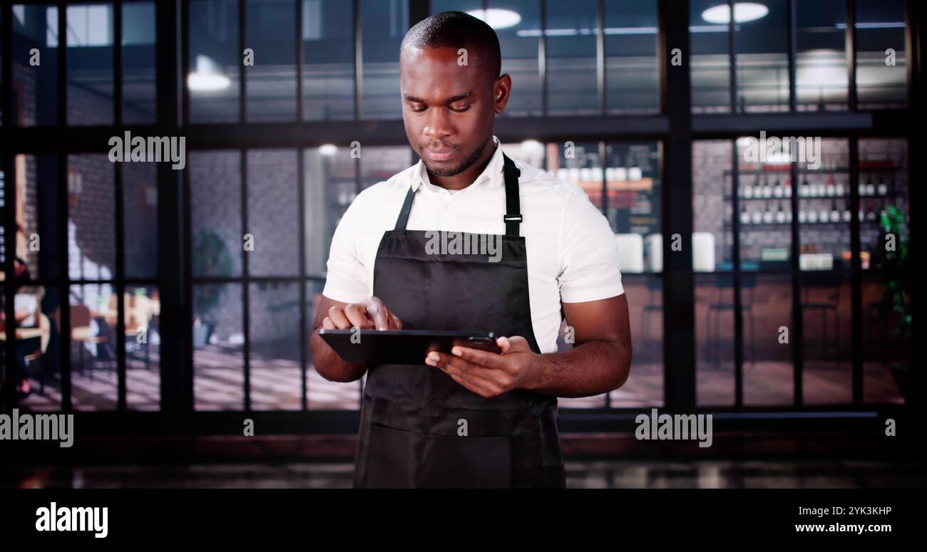 African shop owner computer hi-res stock photography and images - Alamy