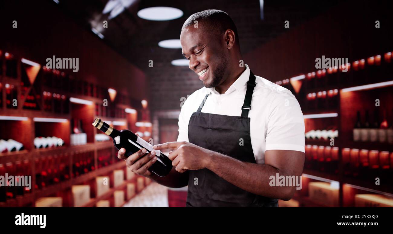 Wine Service Waiter Holding A Bottle In Basement Stock Photo - Alamy