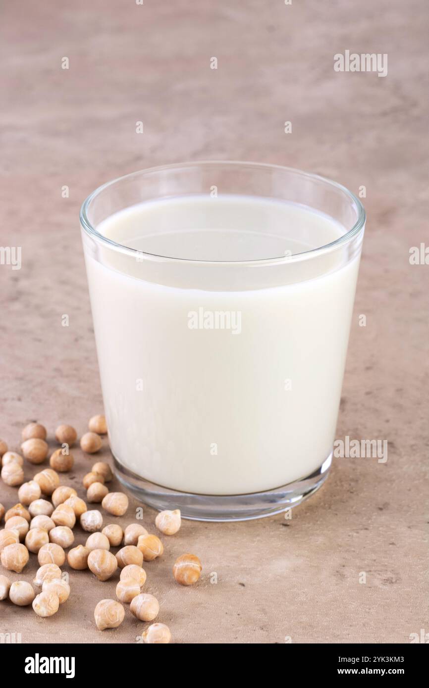 Chickpea milk with chickpeas on a beige background. Lactose free milk ...