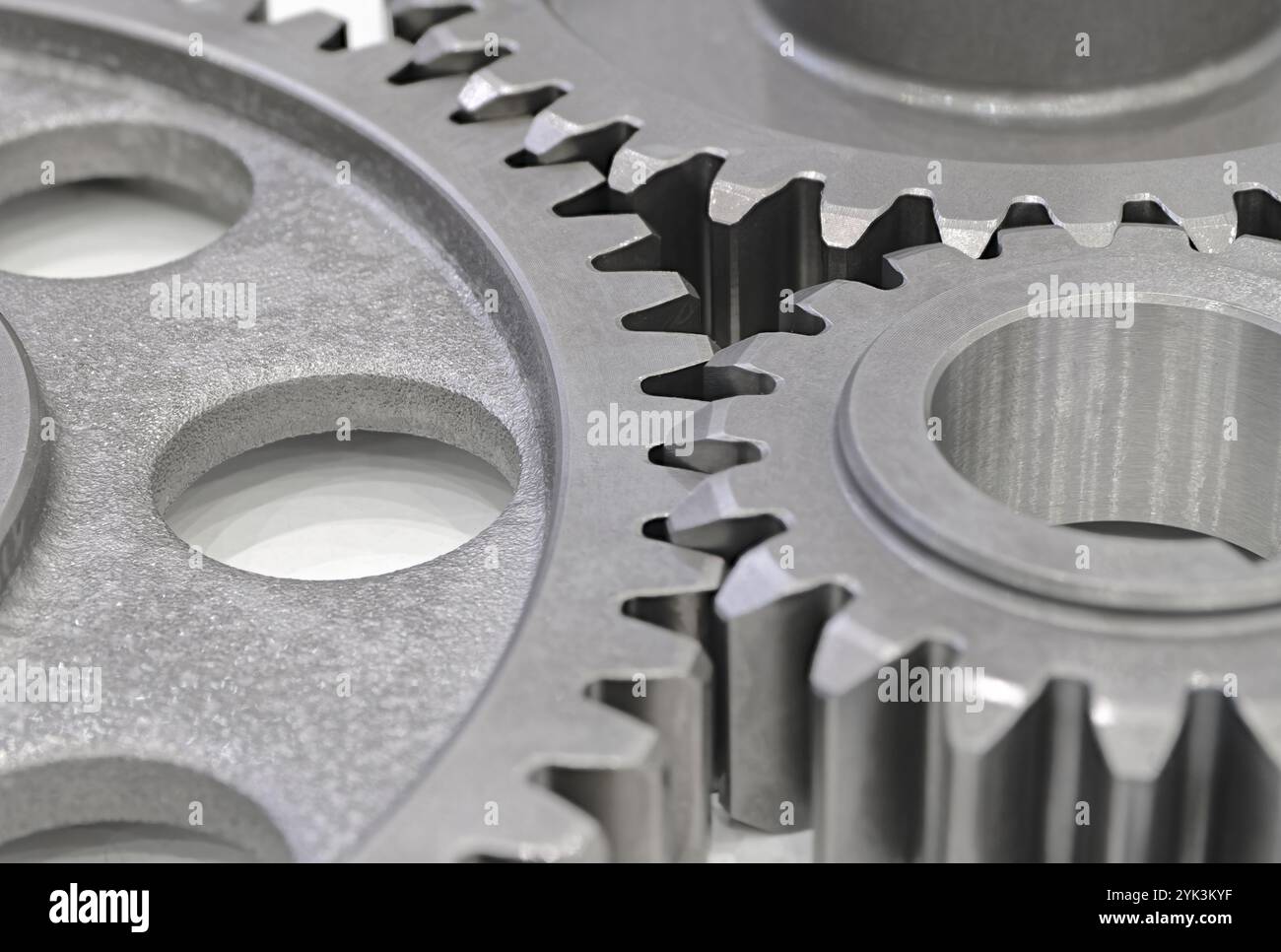 Three steel gearwheels, part of gear transmission, close up shot ...