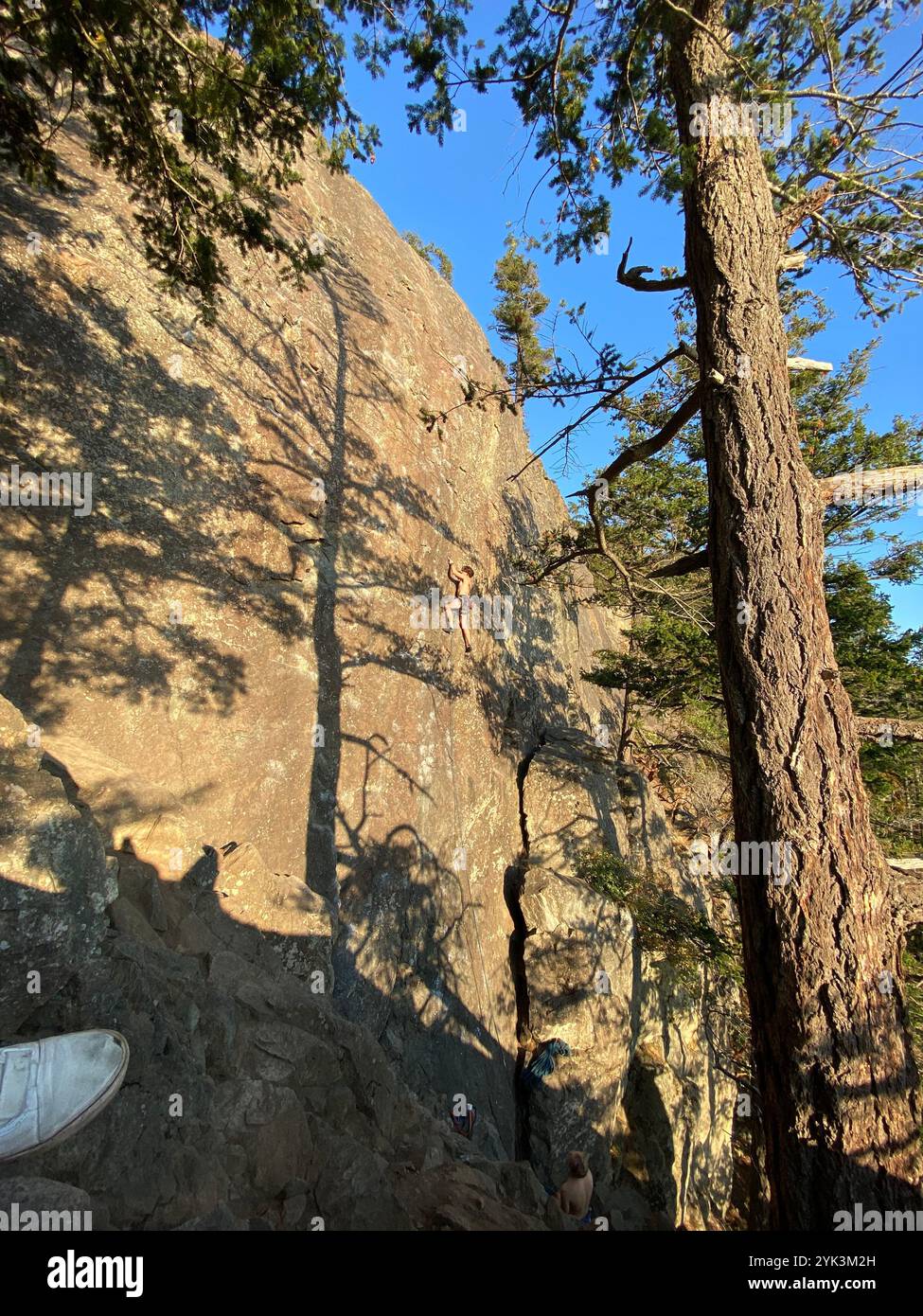 Rock climbing cliff side Stock Photo - Alamy