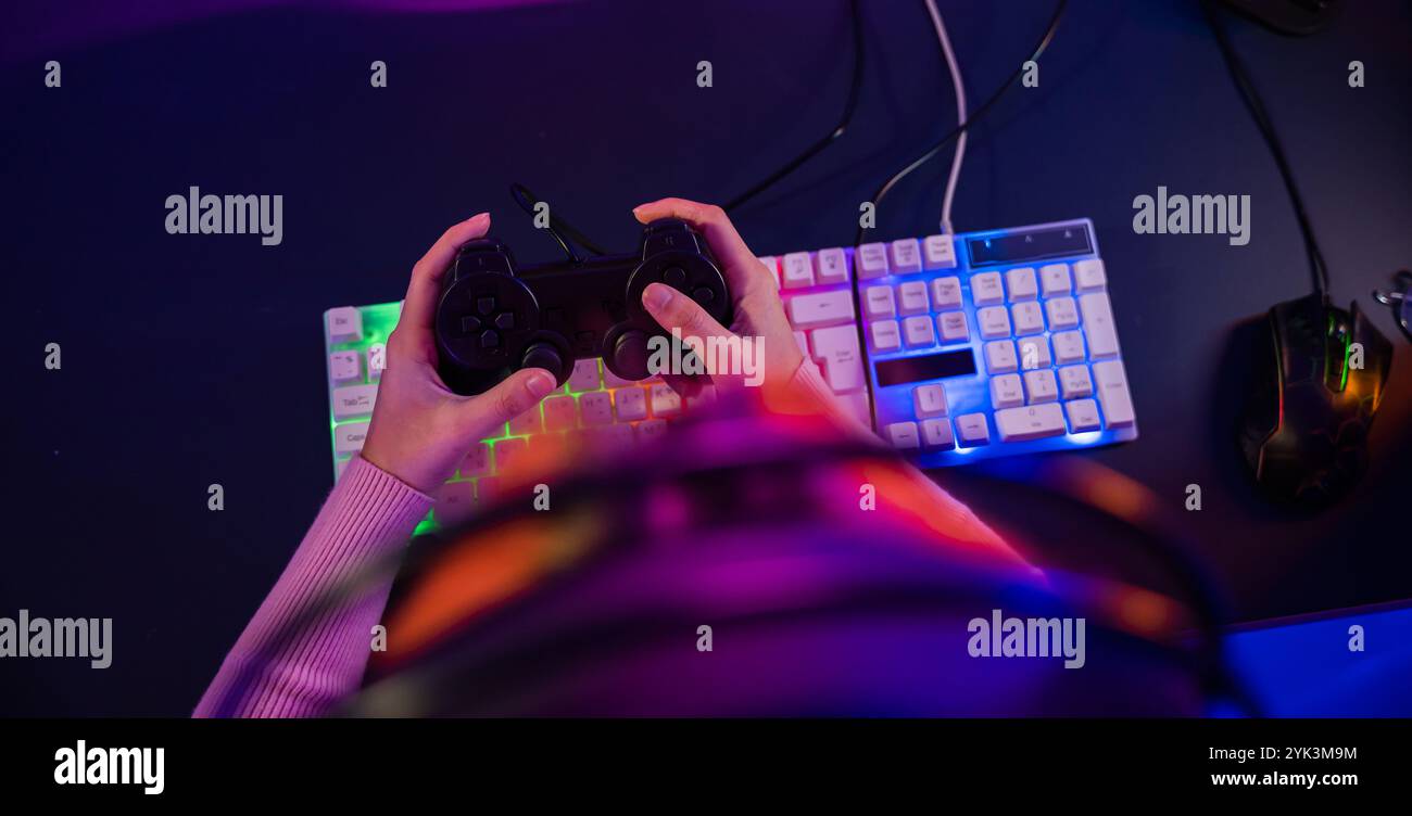 Gamer using joystick controller for virtual tournament plays online ...