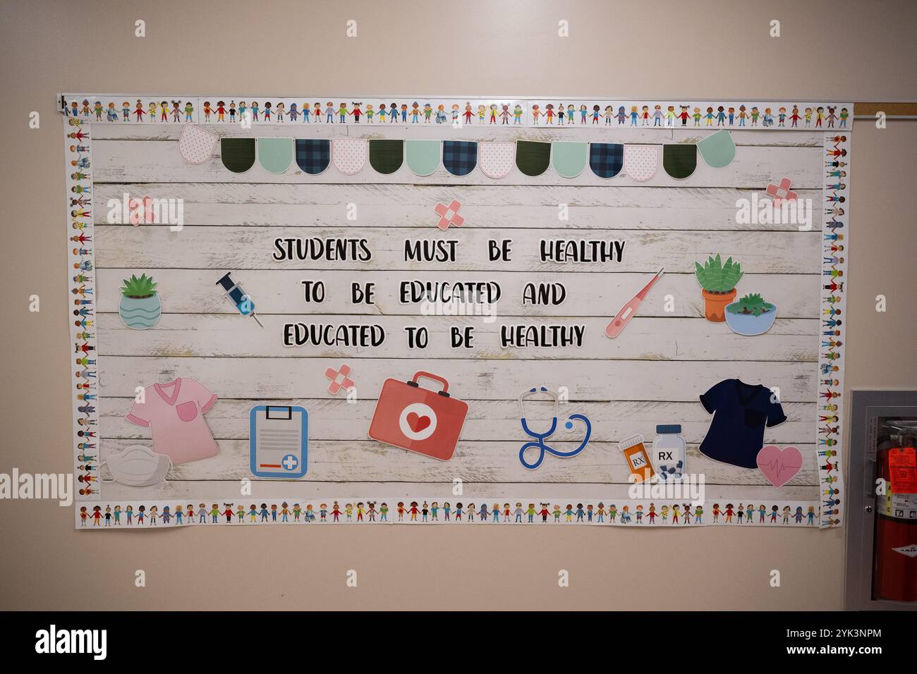 A sign on the wall of the Northwest Elementary School shows the one of ...