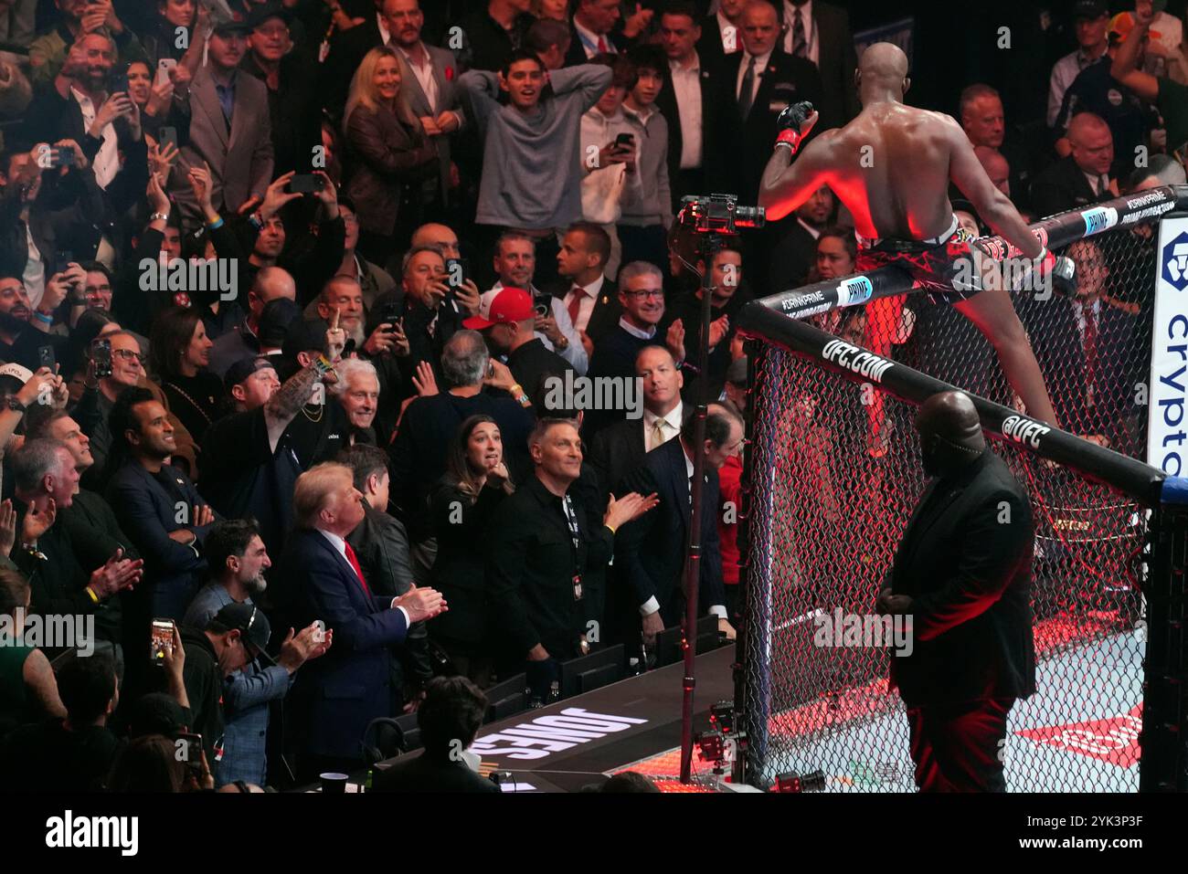 President-elect Donald Trump watches as Jon Jones reacts after ...