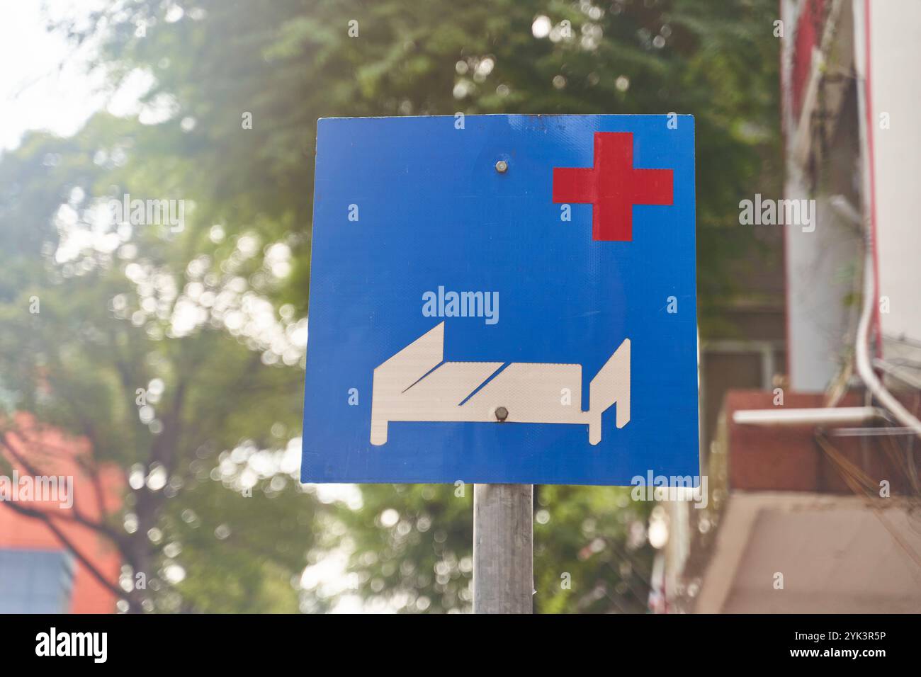 World Red Cross on electric blue rectangular sign with hospital bed ...