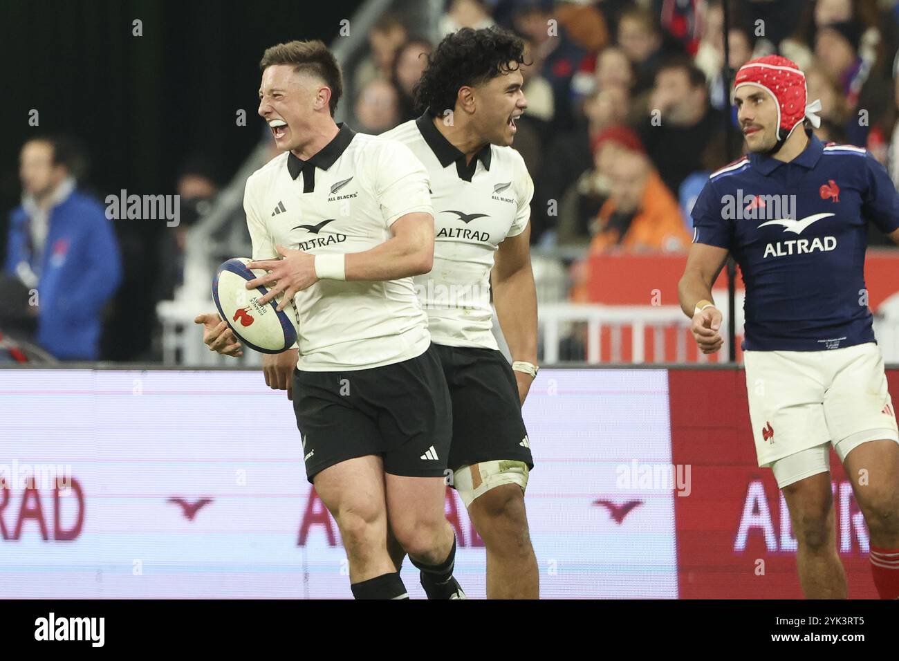 Cam Roigard of New Zealand celebrates his try with Wallace Sititi of ...