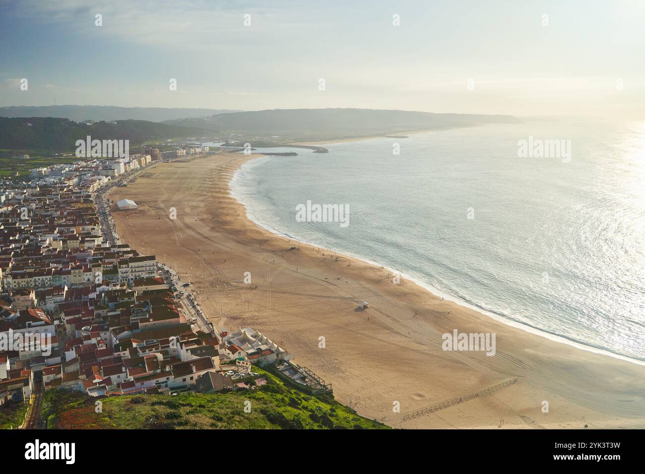 View Nazare beach riviera with cityscape of Nazare town at sunny ...